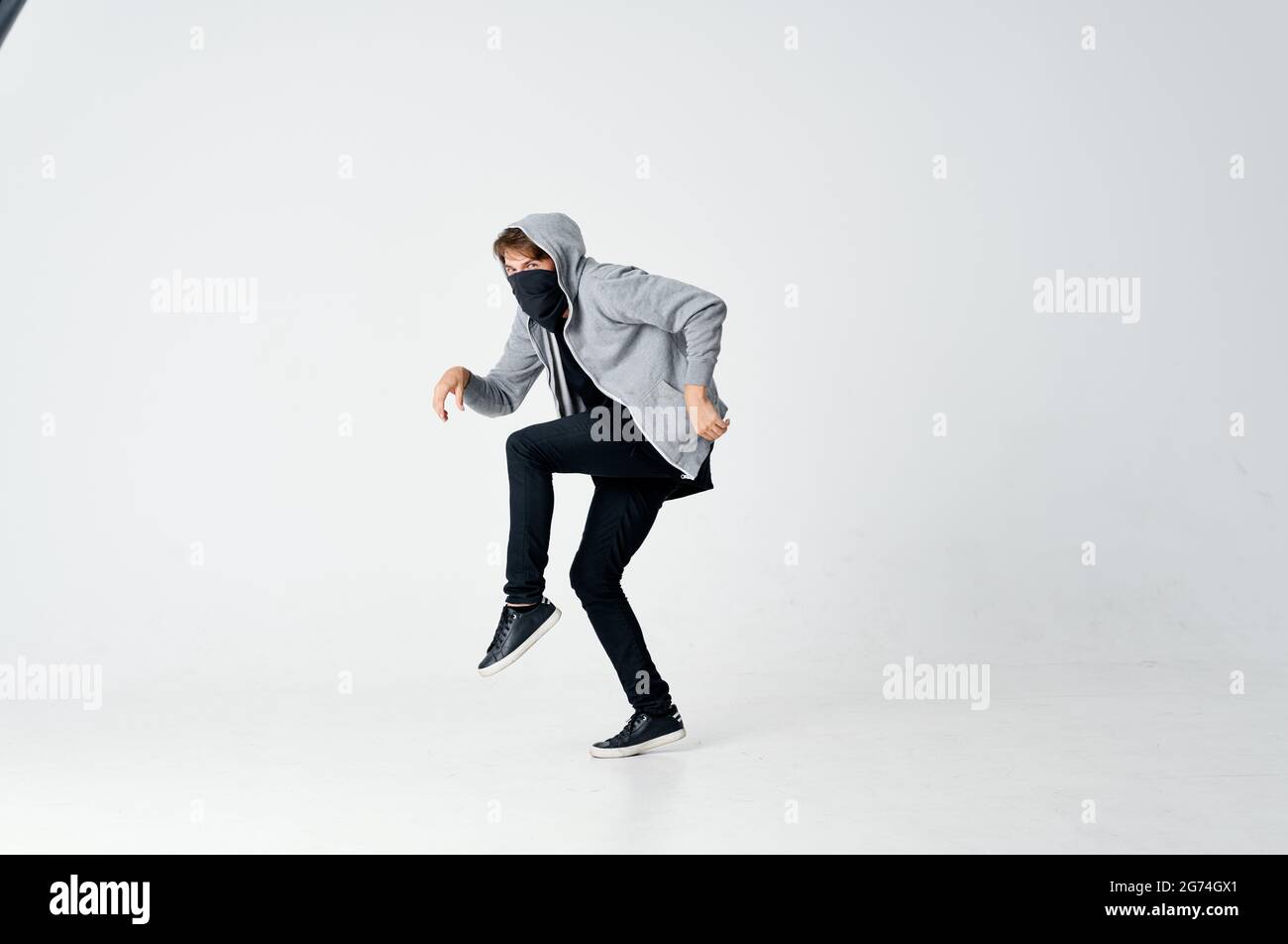 man thief hides his face crime hacker gangster Stock Photo - Alamy