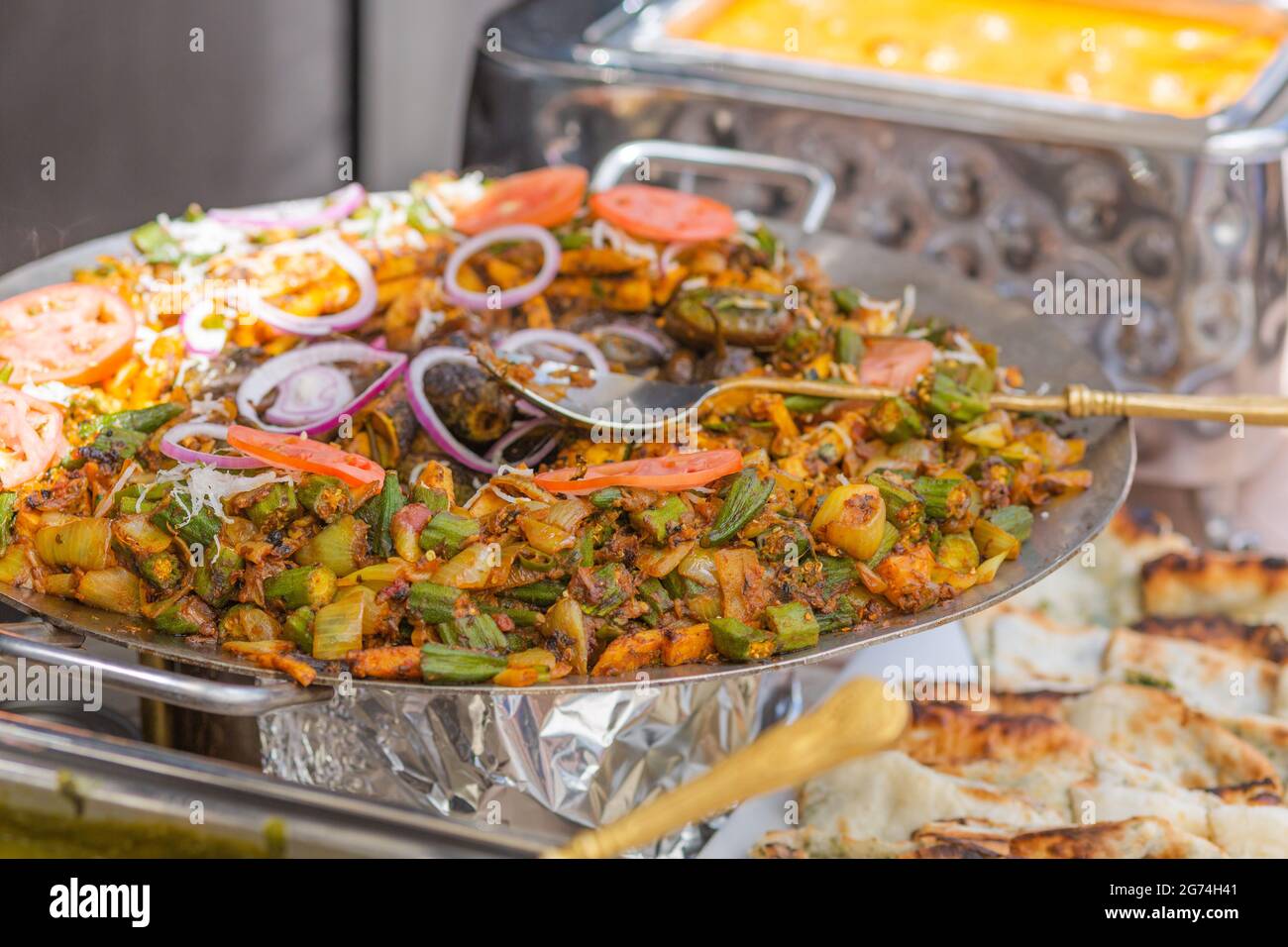 A buffet table with different delicious meals to be served Stock Photo ...