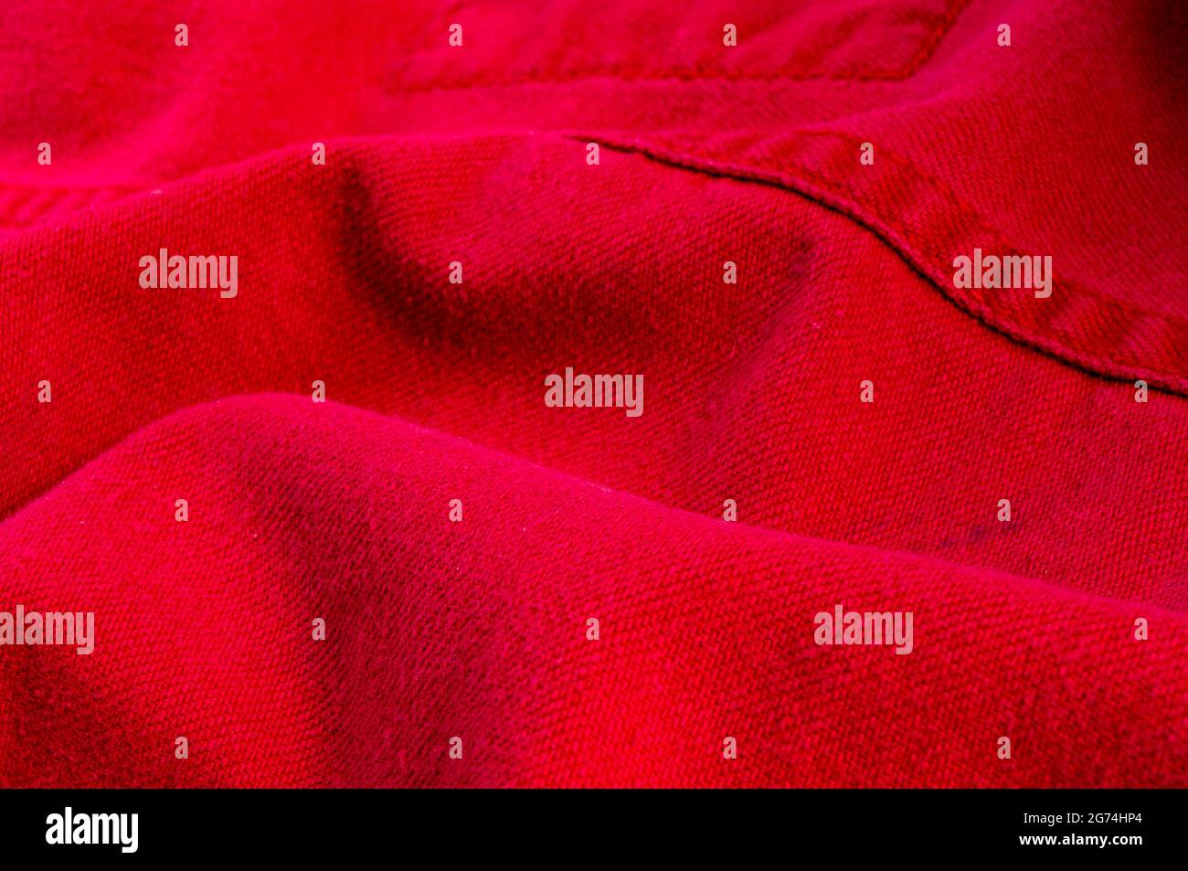 clothing items washed red cotton fabric texture with seams, clasps ...