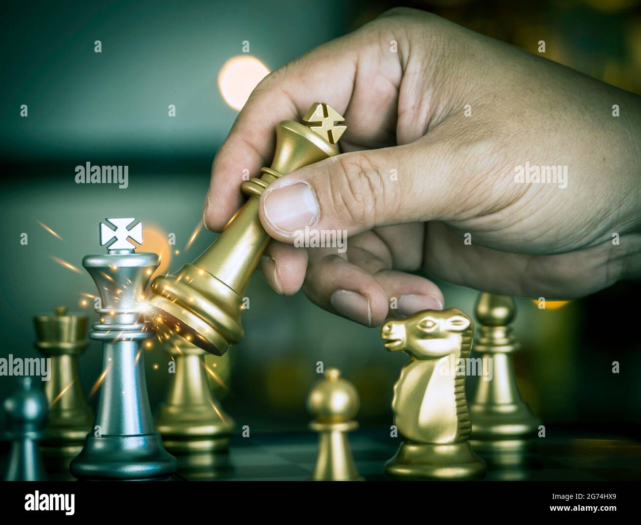 Hand businessman moving the golden king chess fighting silver king with ...