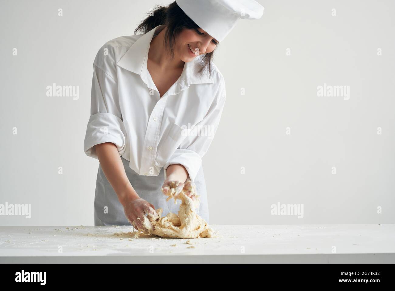 Woman works dough flour cooking hi-res stock photography and images - Alamy