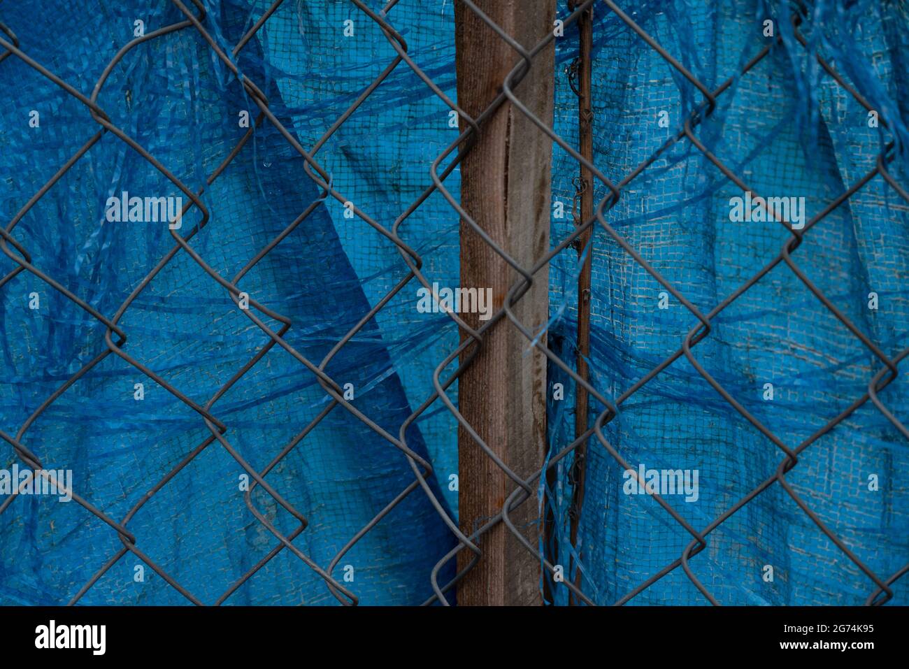 background in the form of a netting mesh and blue fabric Stock Photo ...