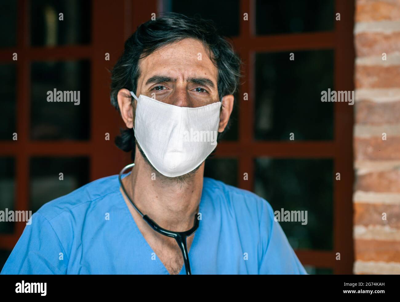 A shot of a Caucasian doctor from Argentina wearing a face mask Stock ...