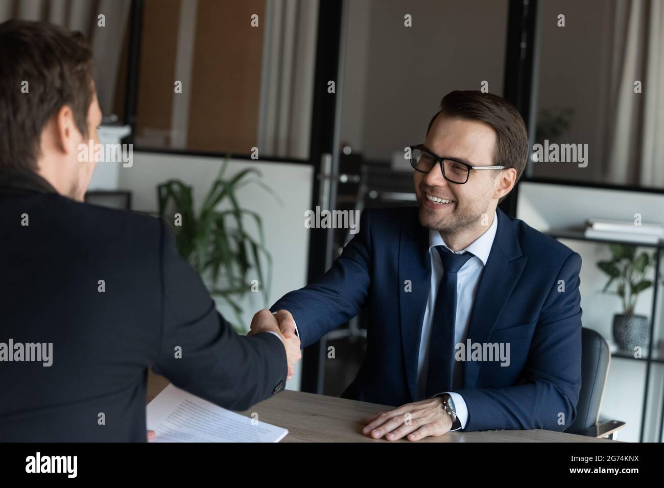 Employer hiring happy candidate after successful interview Stock Photo ...