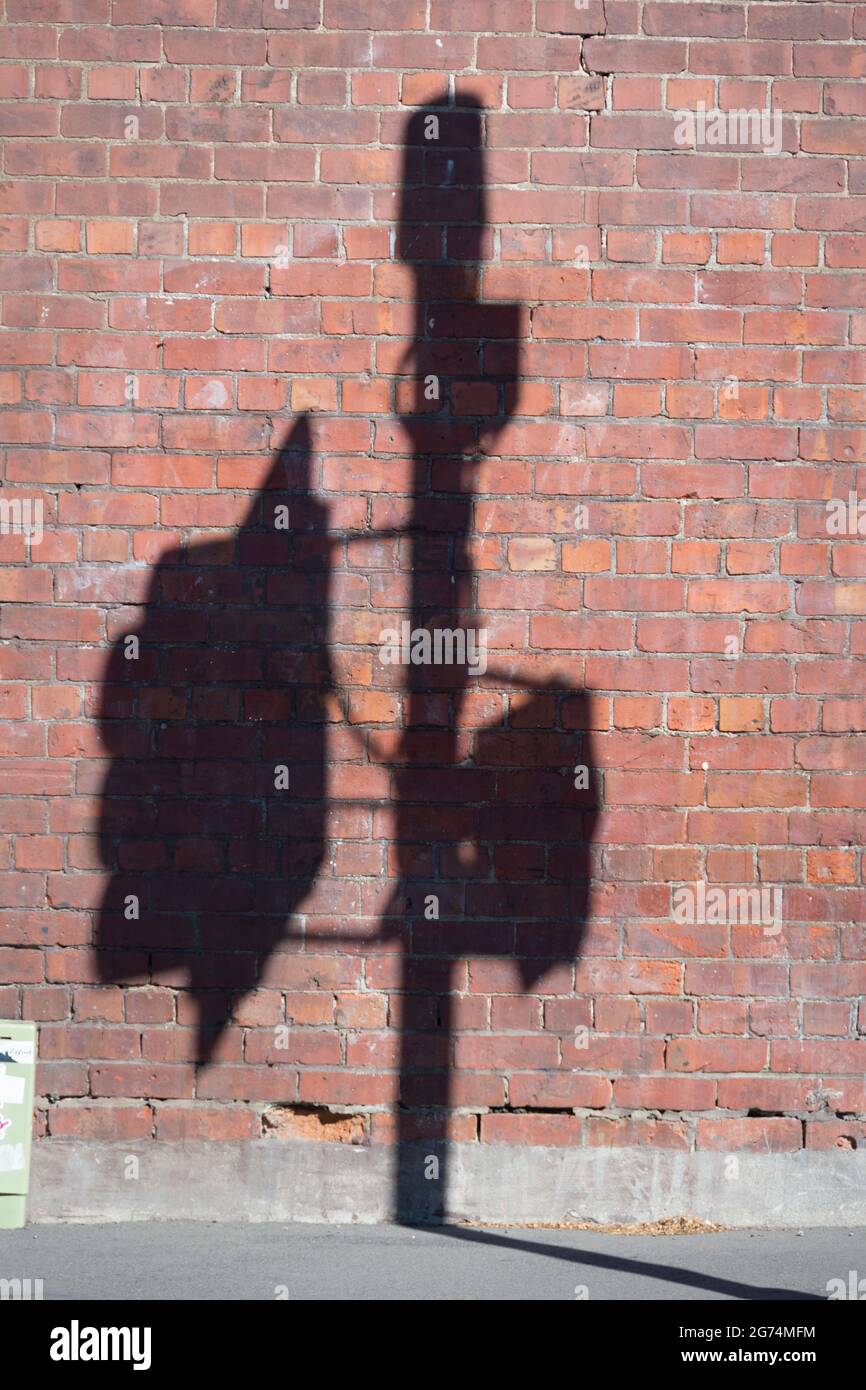 Shadow of traffic light on brick wall, Wellington, North Island, New ...