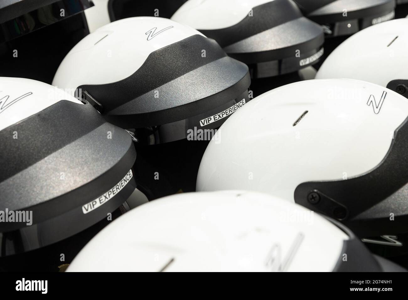 Helmets provided for VIP guests to try electric cars during ABB Formula ...