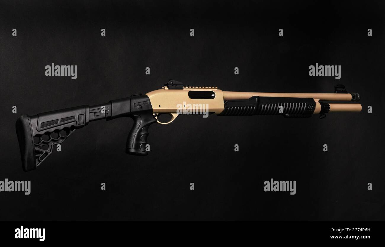 Modern tactical pump action shotgun. Weapon on a dark background Stock ...