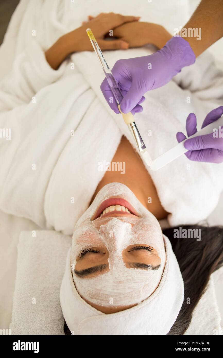 A Spanish female taking spa facial treatment Stock Photo - Alamy