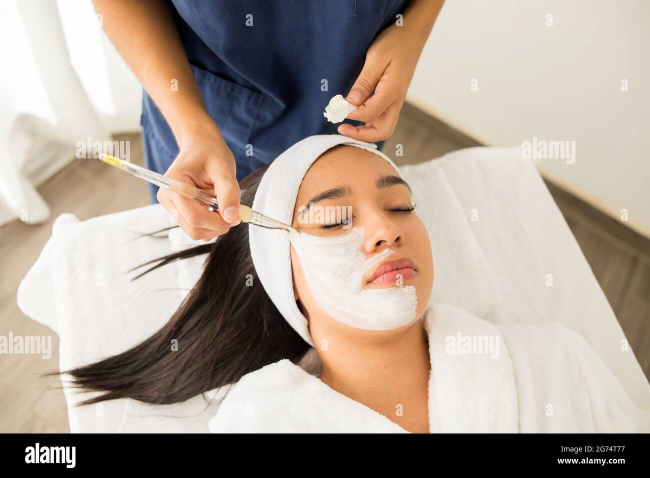 A Spanish female taking spa facial treatment Stock Photo - Alamy