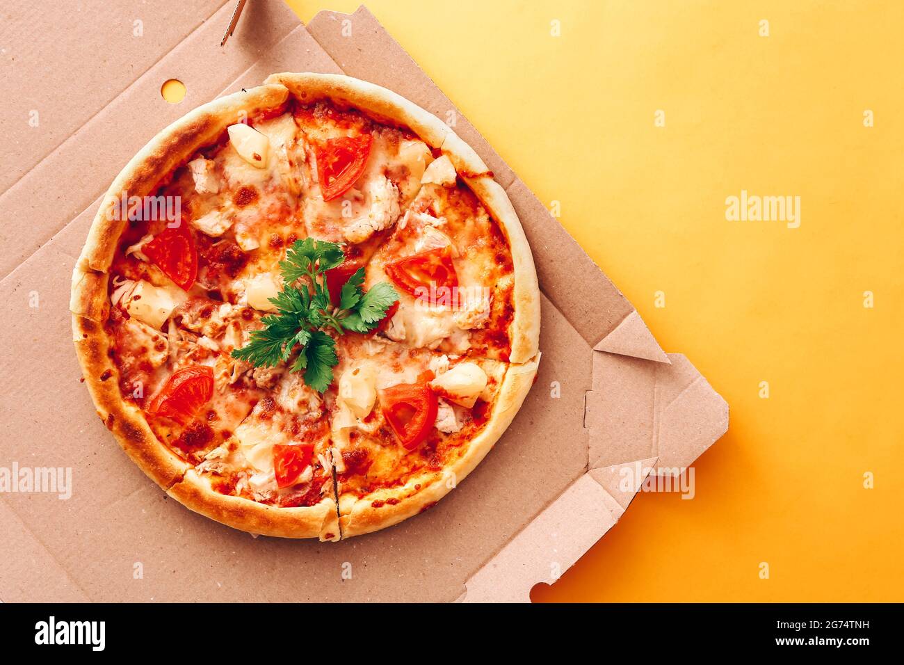 Tasty pizza in delivery box on yellow background Stock Photo - Alamy