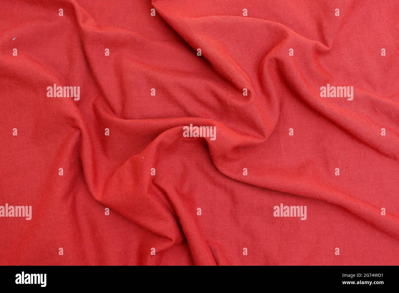 A top view closeup of a wrinkled red cloth texture for a background ...