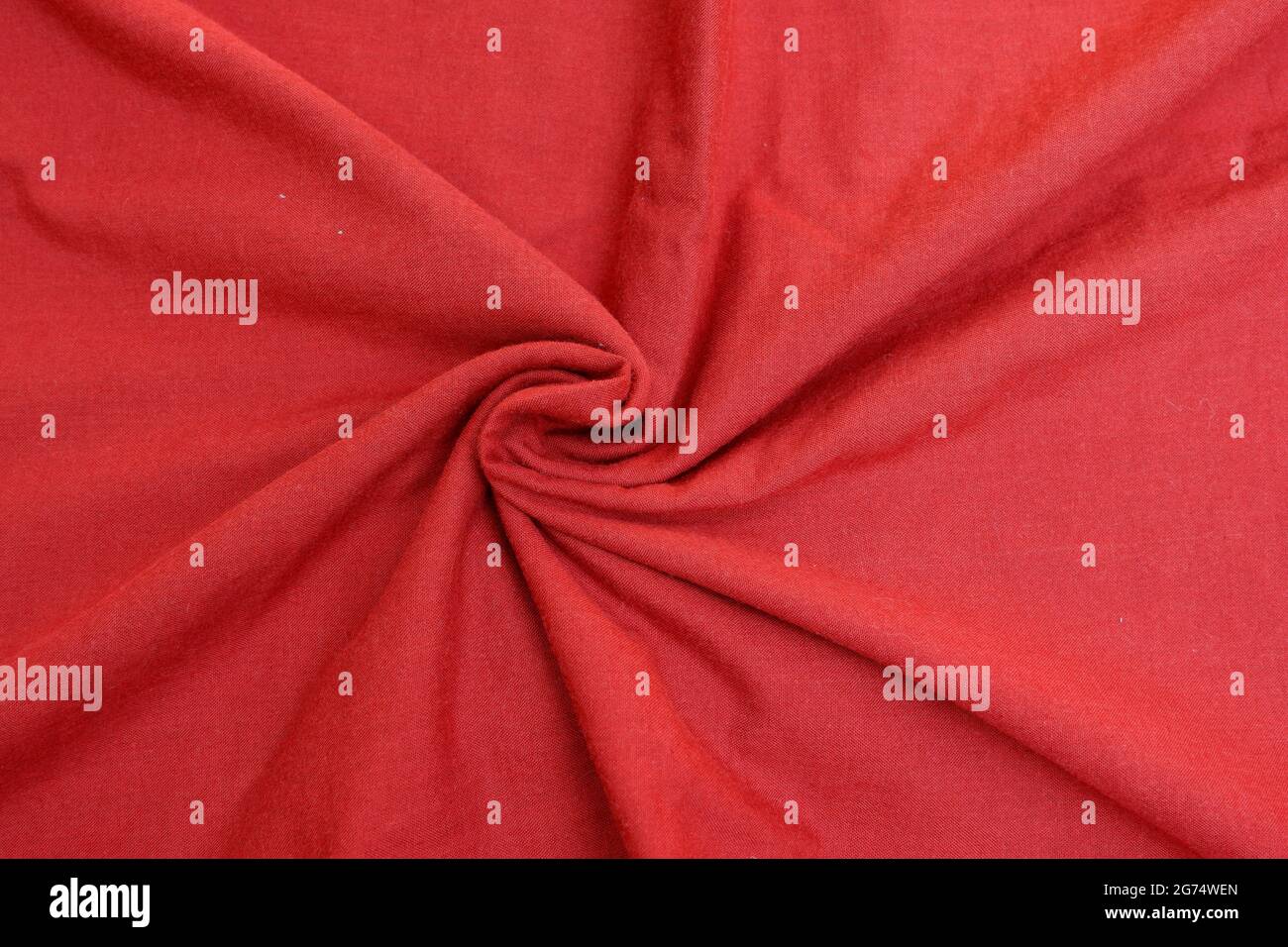 A top view closeup of a wrinkled red cloth texture for a background ...