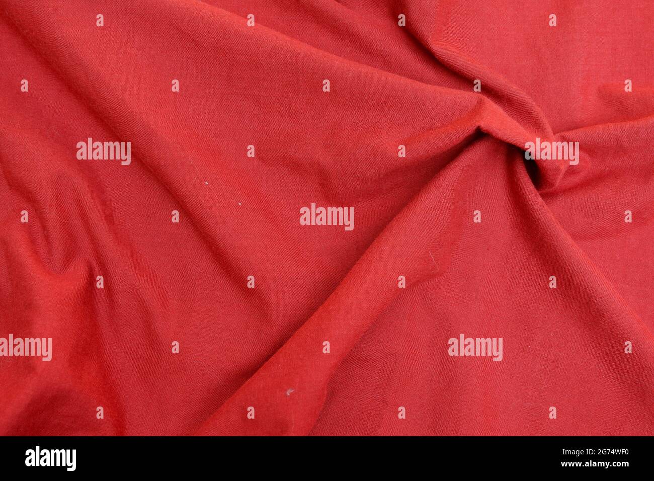 A top view closeup of a wrinkled red cloth texture for a background ...