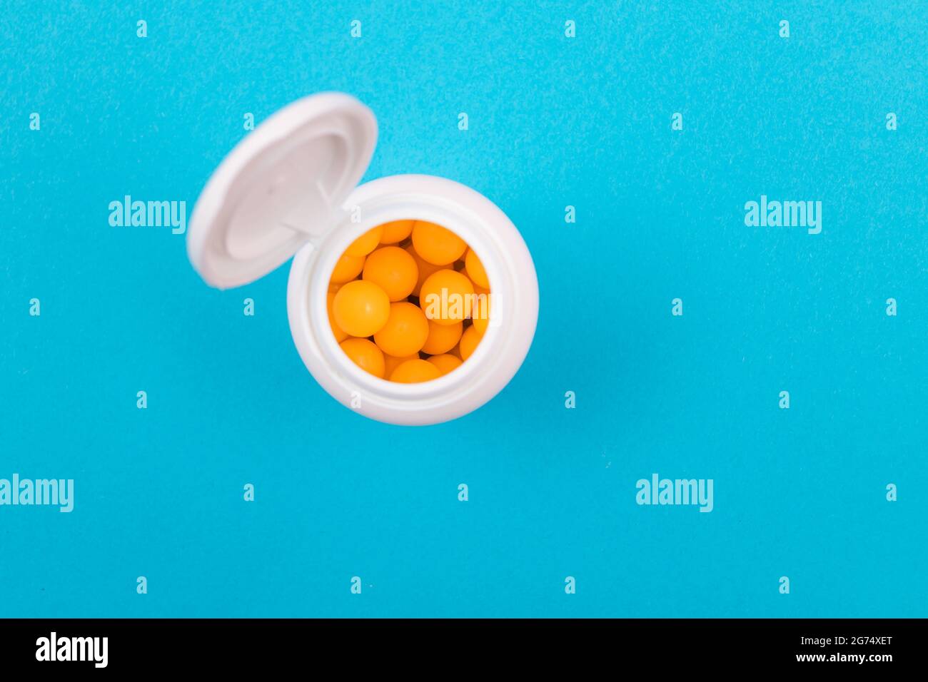 Global Pharmaceutical Industry and Medicinal Products - Yellow Vitamins or Pills in Bottle Lying ...