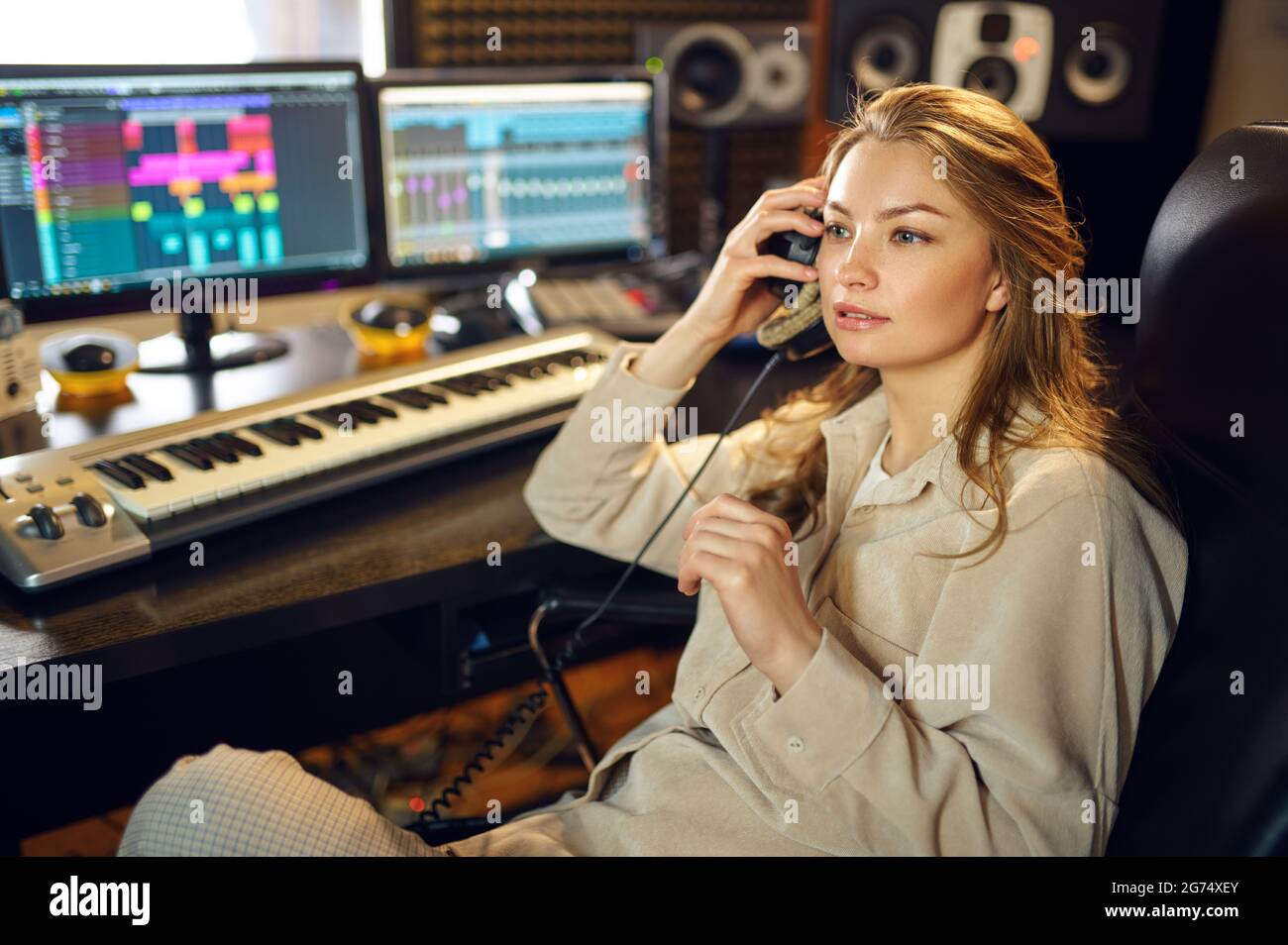 Female dj listening record, recording studio Stock Photo - Alamy