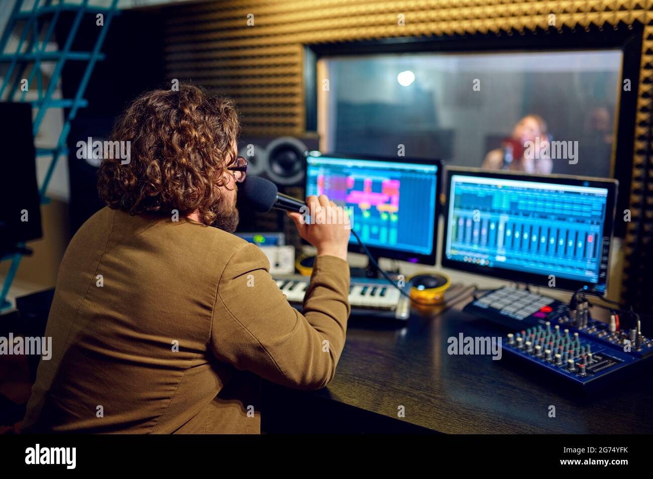 Musician and female performer, recording studio Stock Photo - Alamy