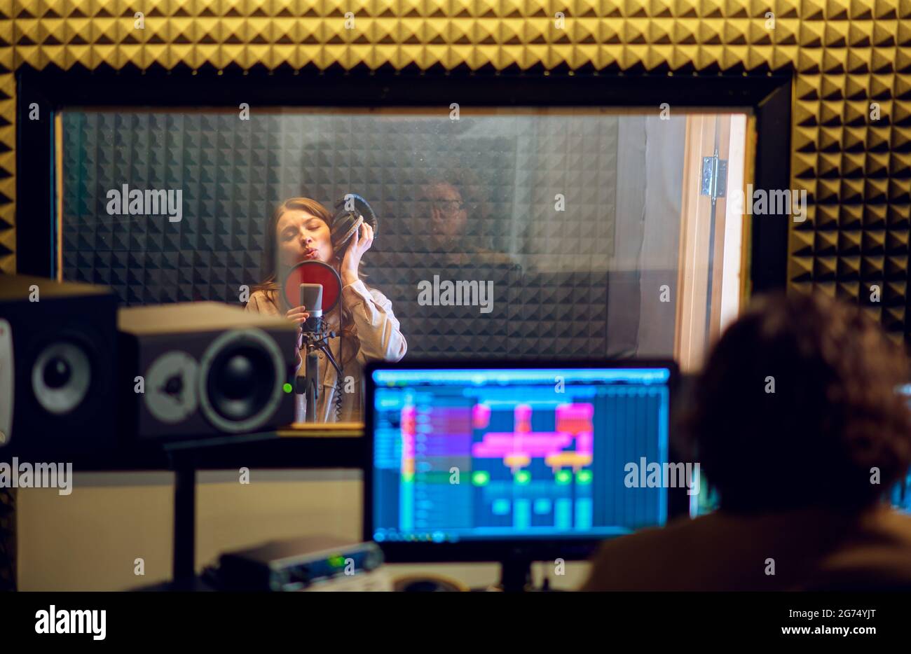 Male musician and female singer, recording studio Stock Photo - Alamy