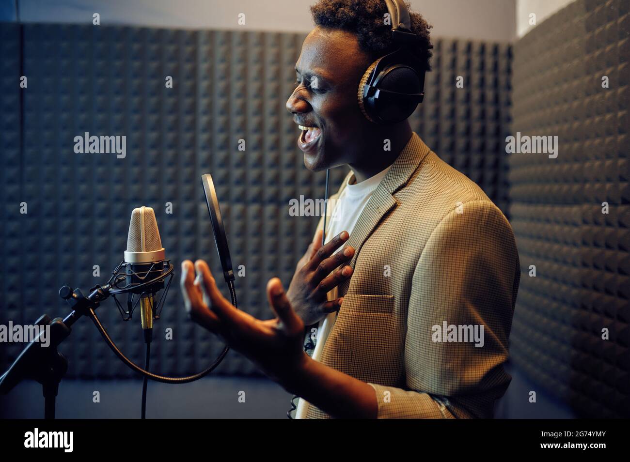 Male singer sings a song, recording studio Stock Photo - Alamy