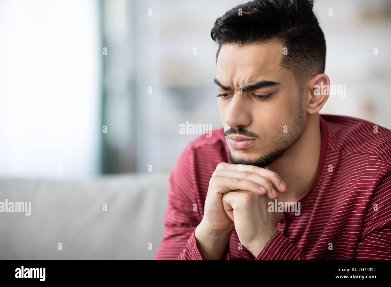 Closeup portrait of stressed arab guy having troubles, copy space Stock ...