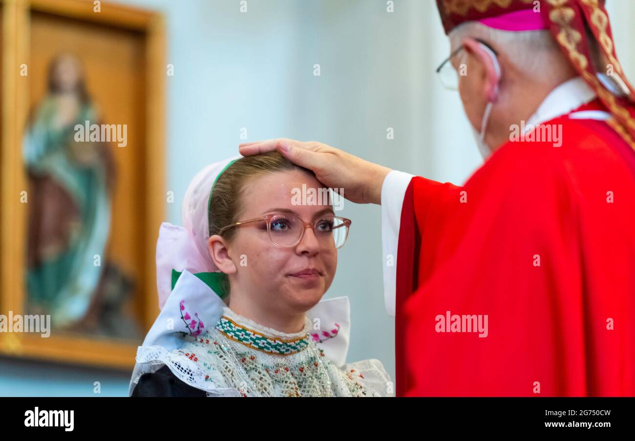 Crostwitz, Germany. 11th July, 2021. A girl receives the blessing ...
