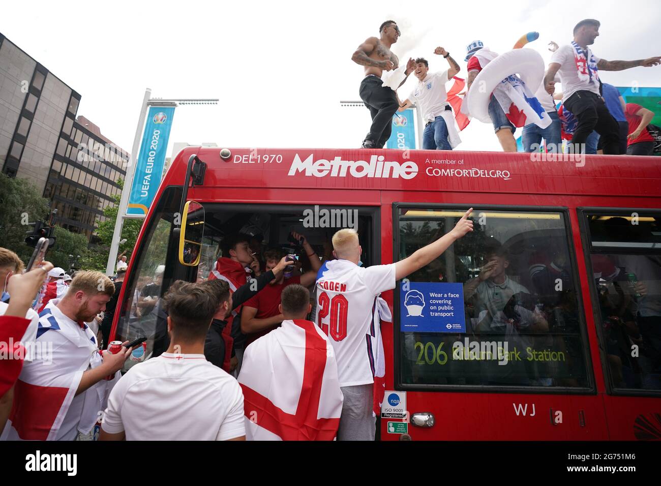 England fans climb aboard a bus outside the ground ahead of the UEFA ...