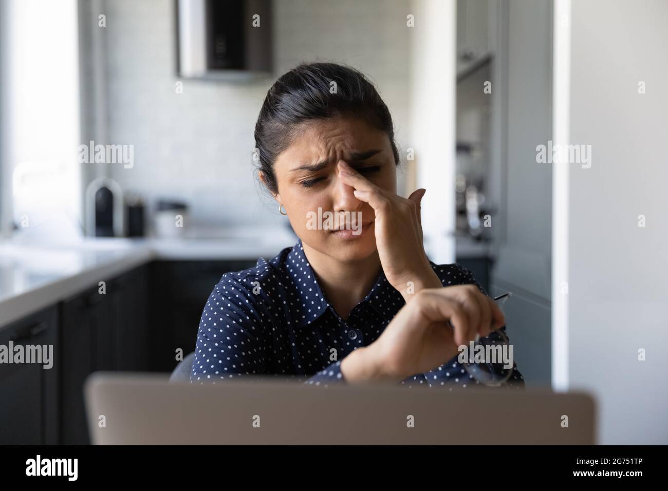 Woman taking off her glasses hi-res stock photography and images - Alamy