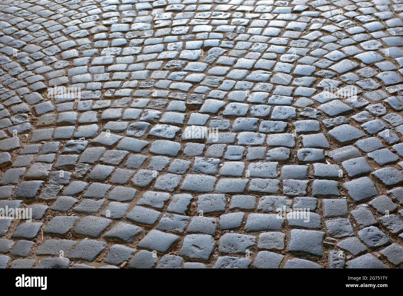 Old square shape cobblestones bricks street surface Stock Photo - Alamy