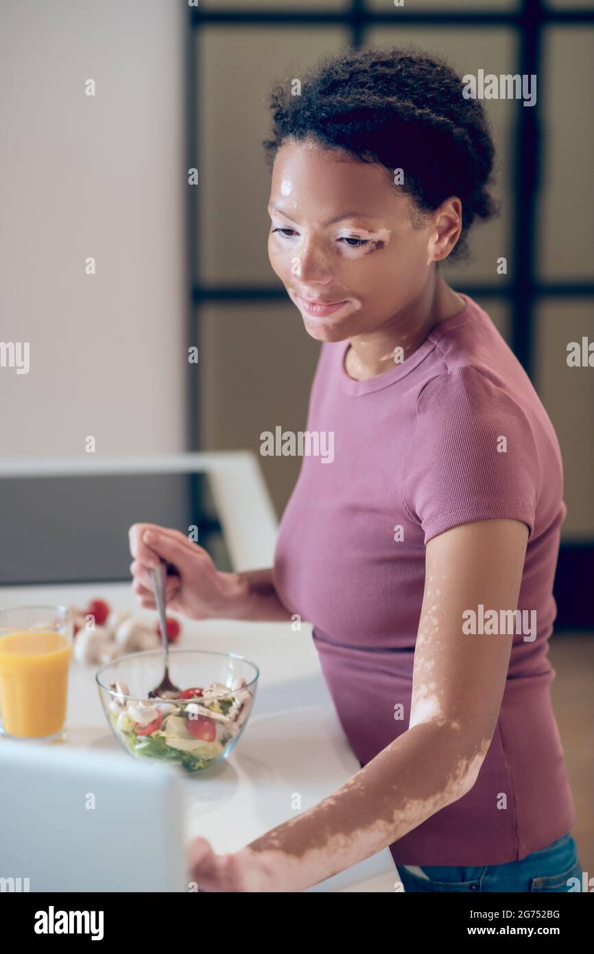 This is a woman eating something hi-res stock photography and images ...