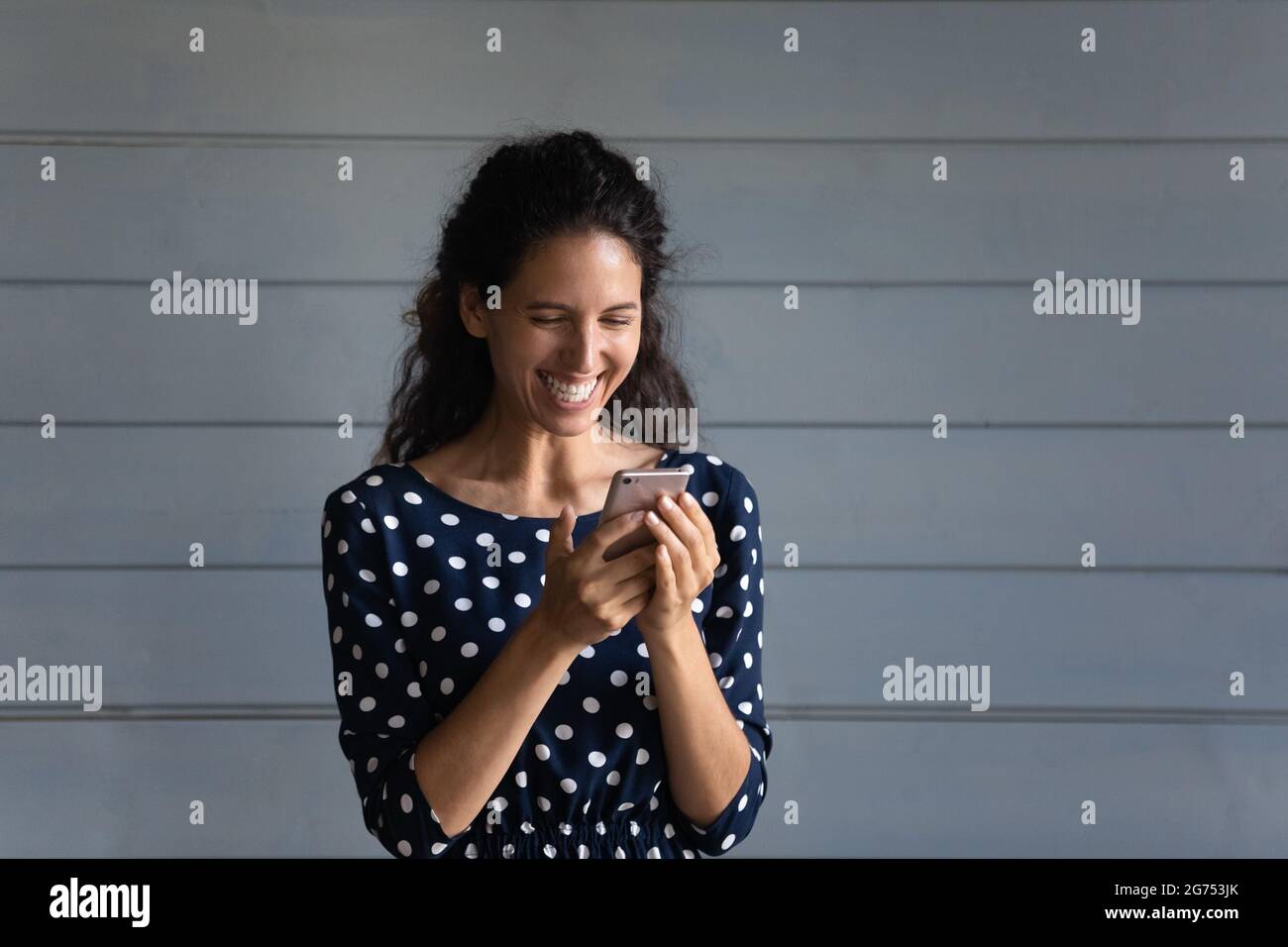Excited woman laughing on phone hi-res stock photography and images - Alamy