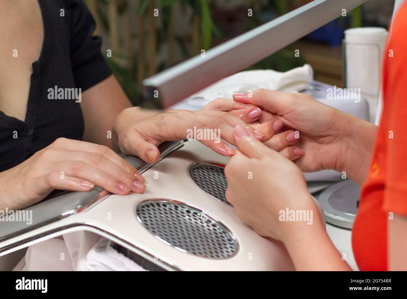 A female getting a manicure at a beauty salon Stock Photo - Alamy