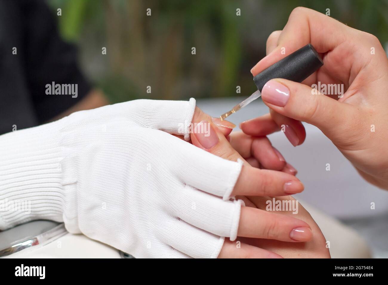 Girl getting a manicure hi-res stock photography and images - Alamy