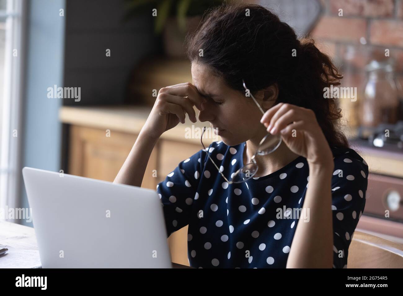 Tired woman working from home, using computer too long Stock Photo - Alamy