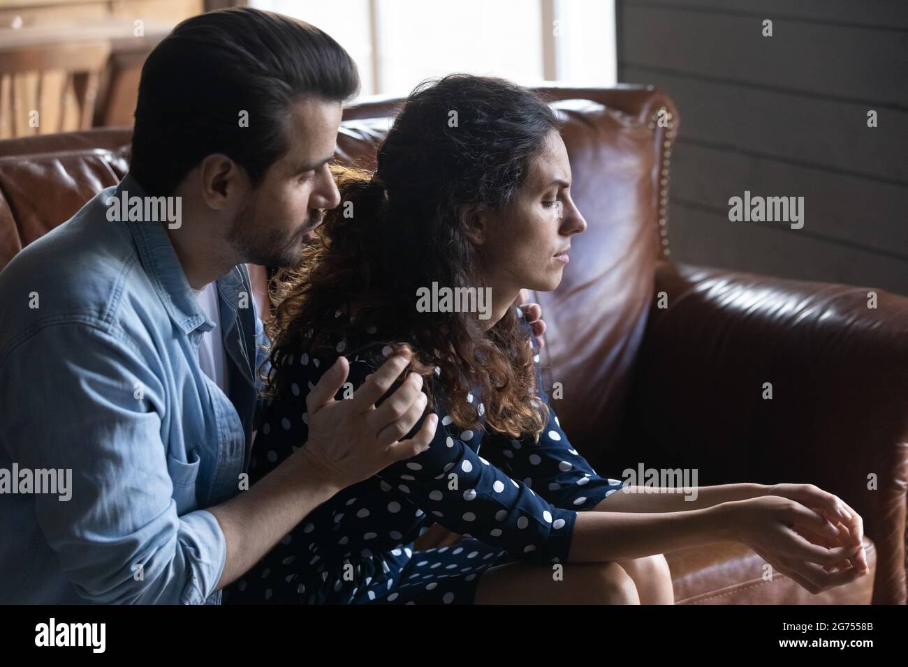 Compassionate husband giving comfort and support to upset wife Stock ...