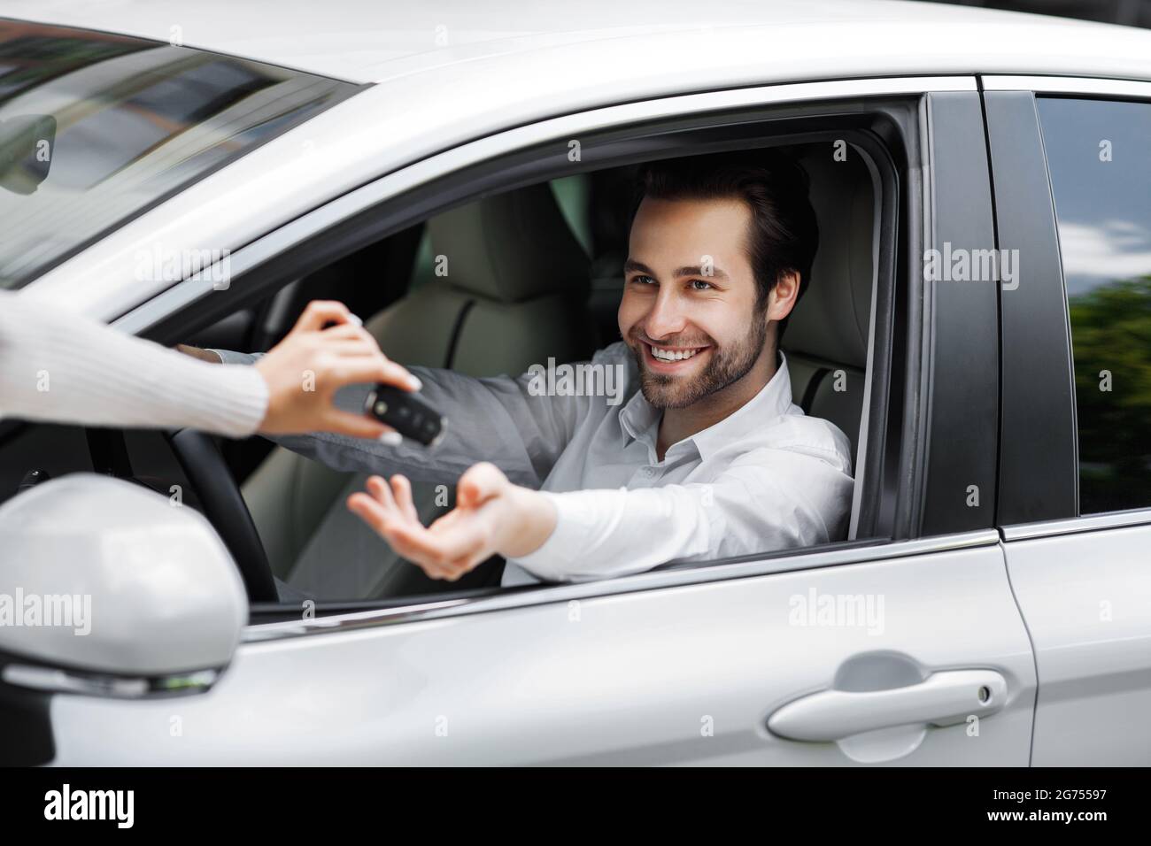 Handing over the car keys hi-res stock photography and images - Alamy