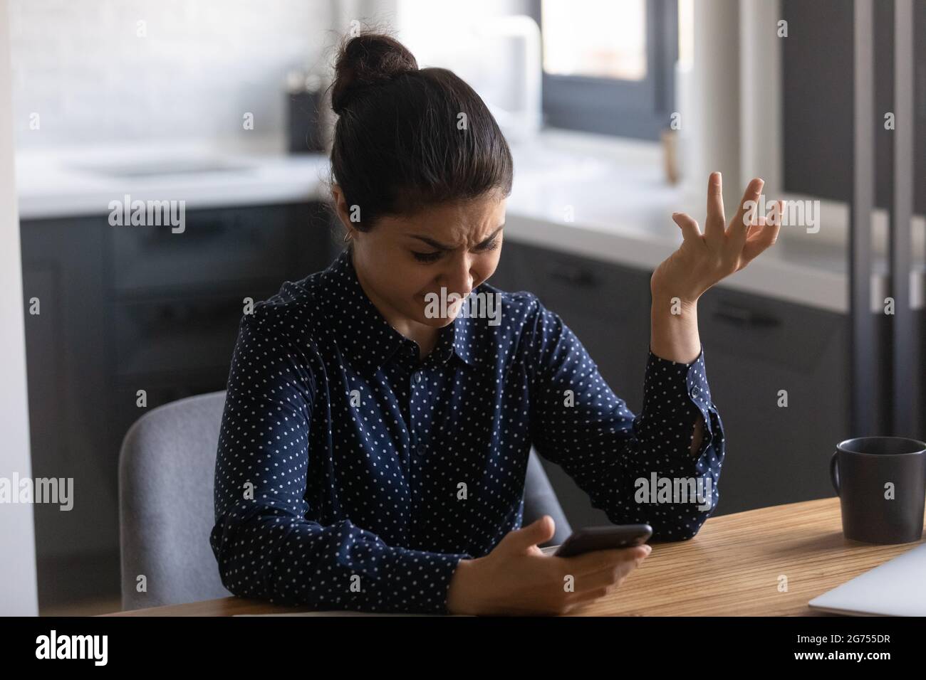 Mobile phone service customer annoyed with app work Stock Photo - Alamy