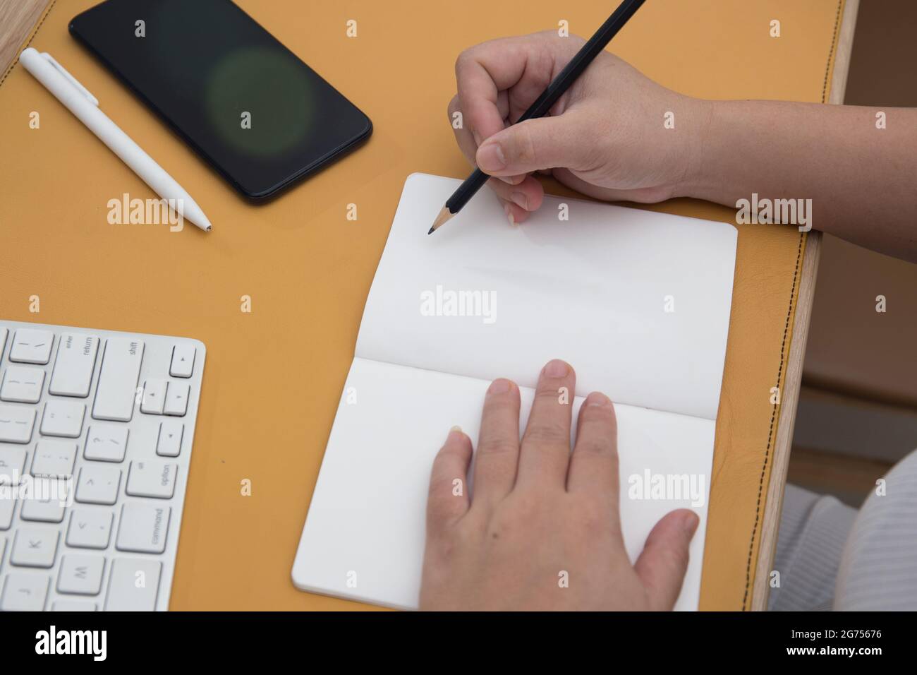 Overhead shot female writing hi-res stock photography and images - Alamy