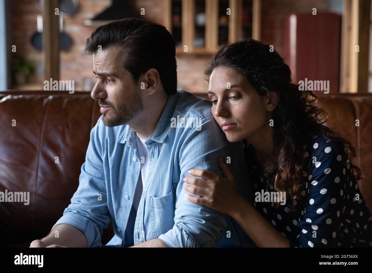 Wife expressing empathy and compassion to sad frustrated husband Stock ...