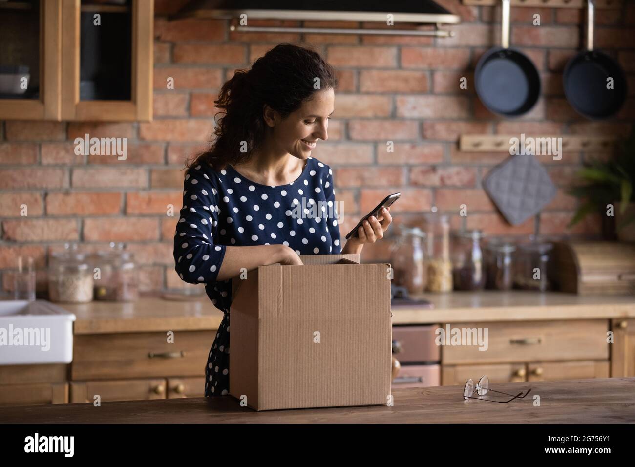 Happy customer receiving package from hi-res stock photography and ...