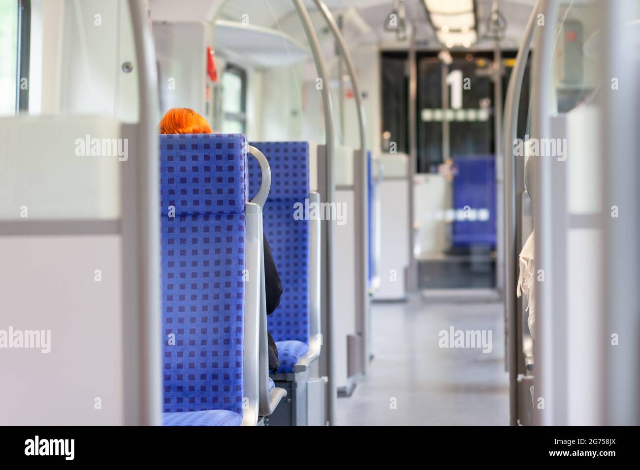 Center aisle and empty rows of seats in a bus Stock Photo - Alamy