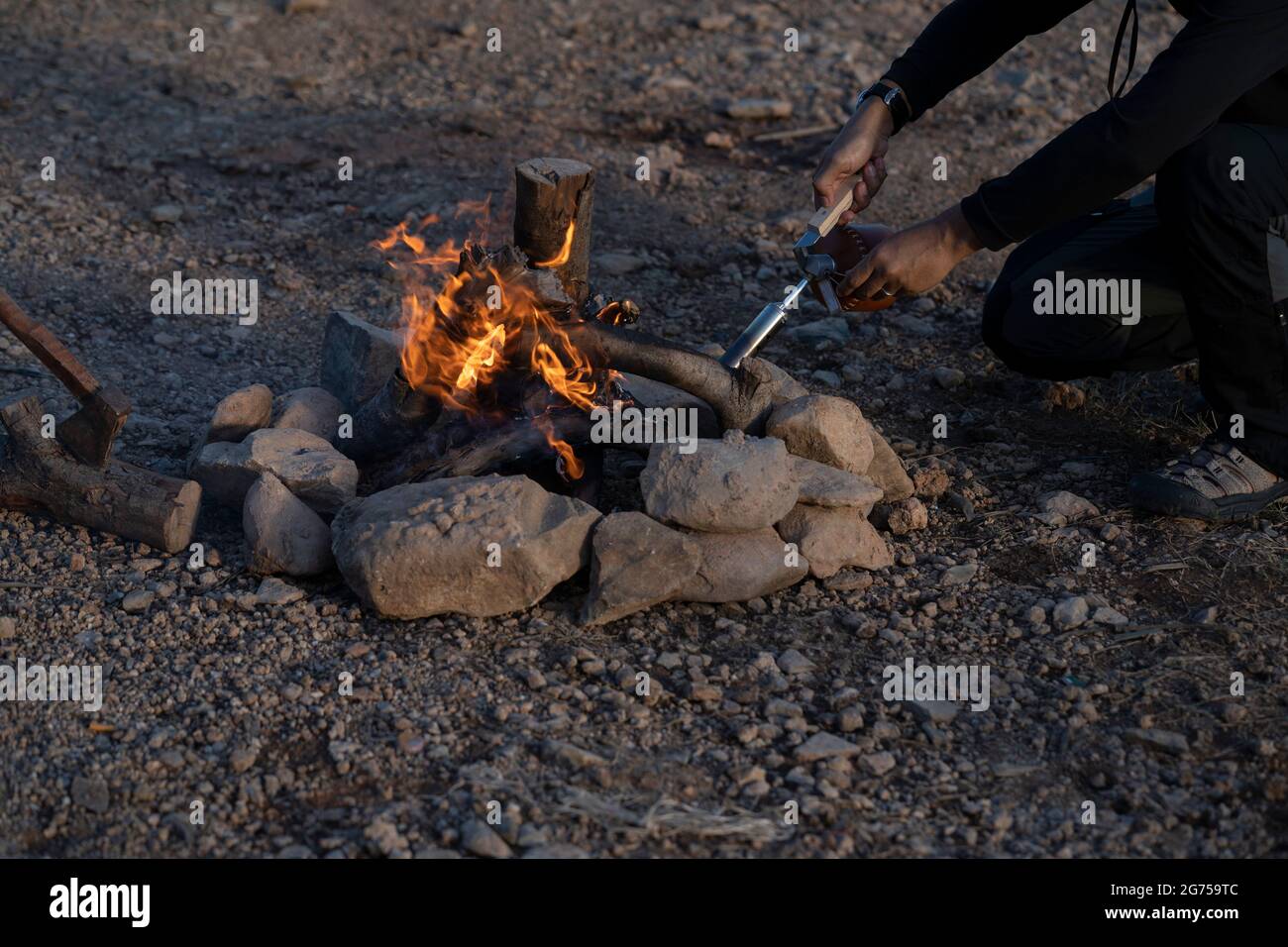 Man lighting campfire hi-res stock photography and images - Alamy