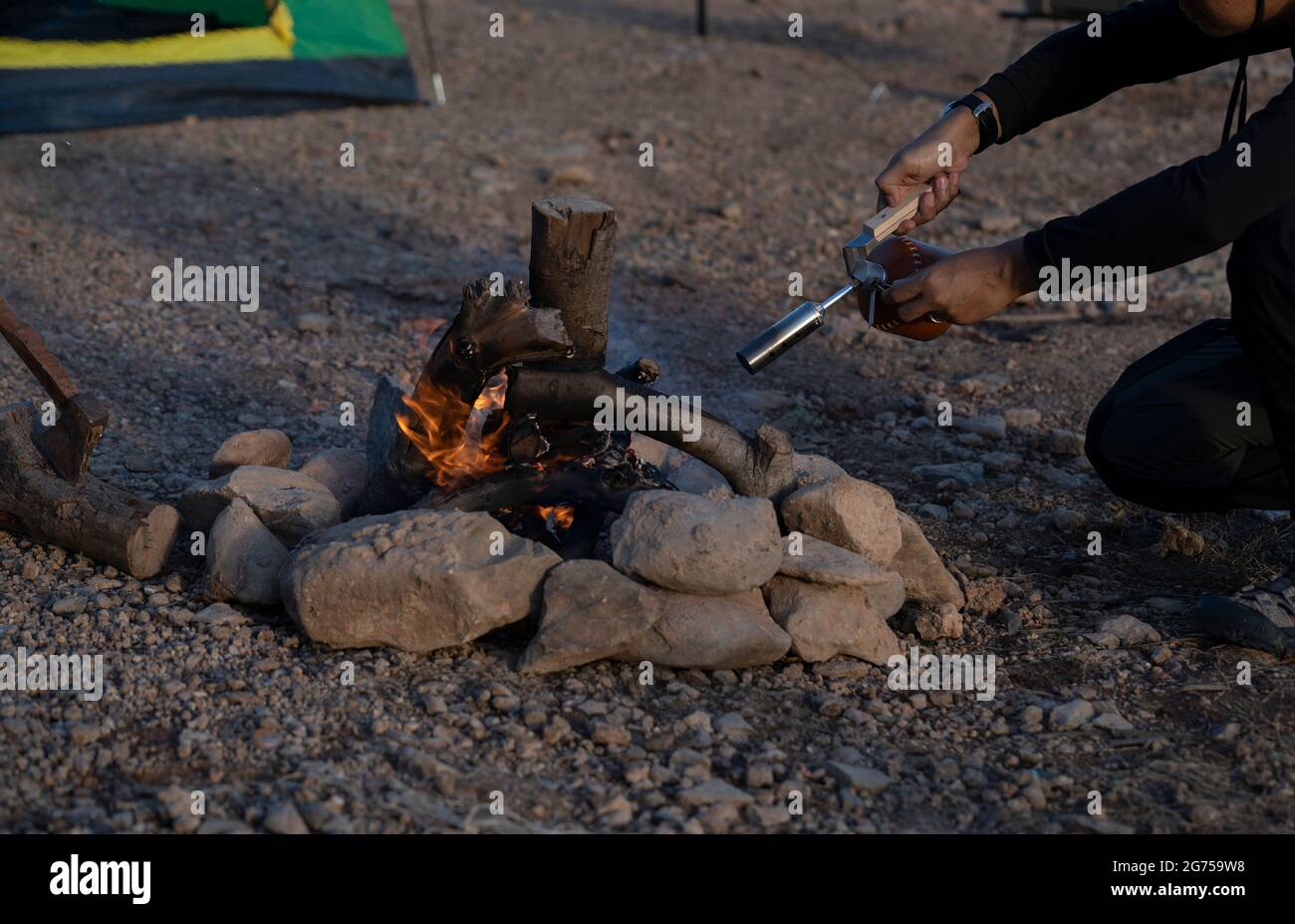 Man lighting campfire hi-res stock photography and images - Alamy