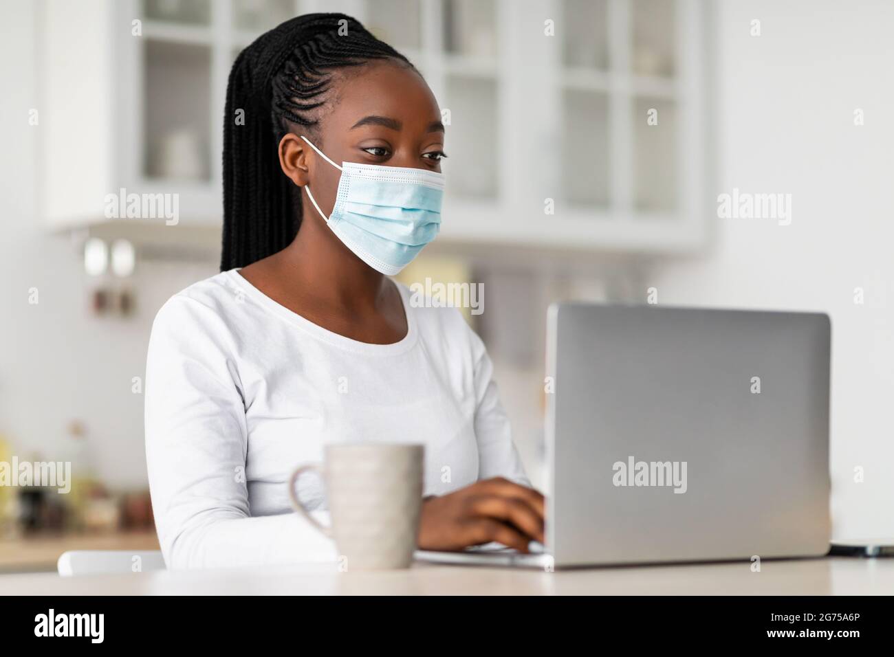 Black woman typing at computer hi-res stock photography and images - Alamy