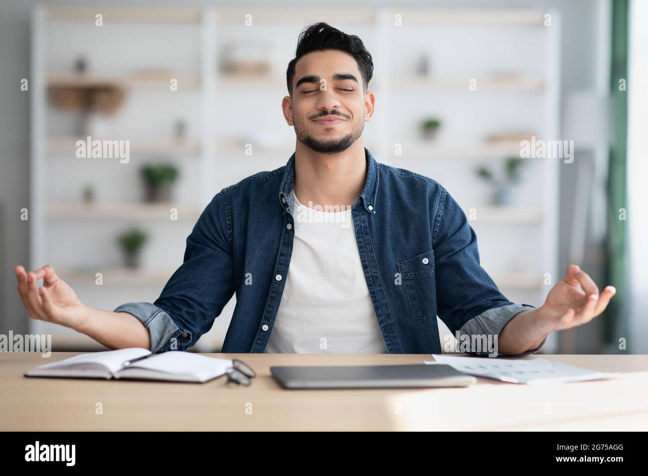 Arab man meditating hi-res stock photography and images - Alamy