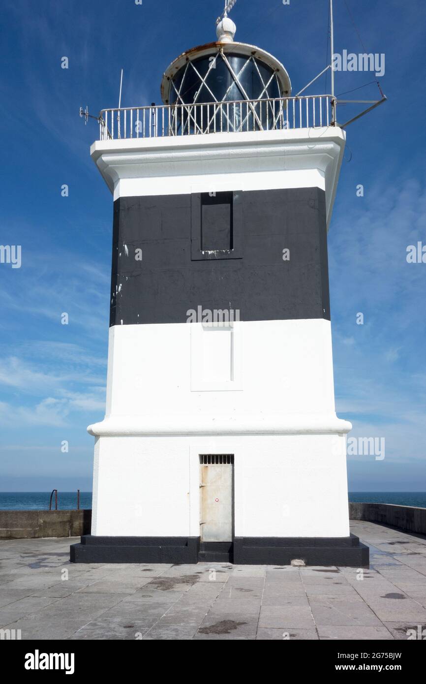Holyhead lighthouse on the end of the breakwater on Holy Island ...