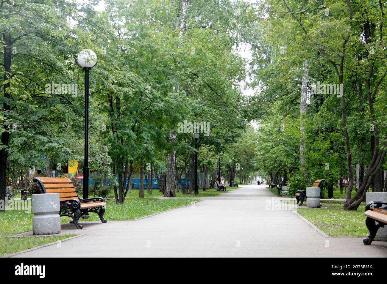 broad empty path in the city park. Recreation concept Stock Photo - Alamy