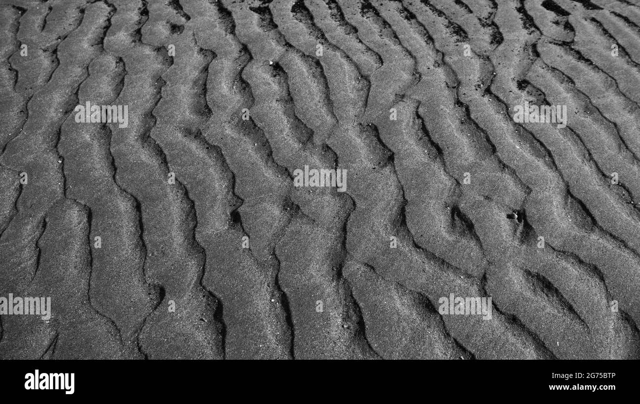 Abstract background in black and white on sand Stock Photo - Alamy