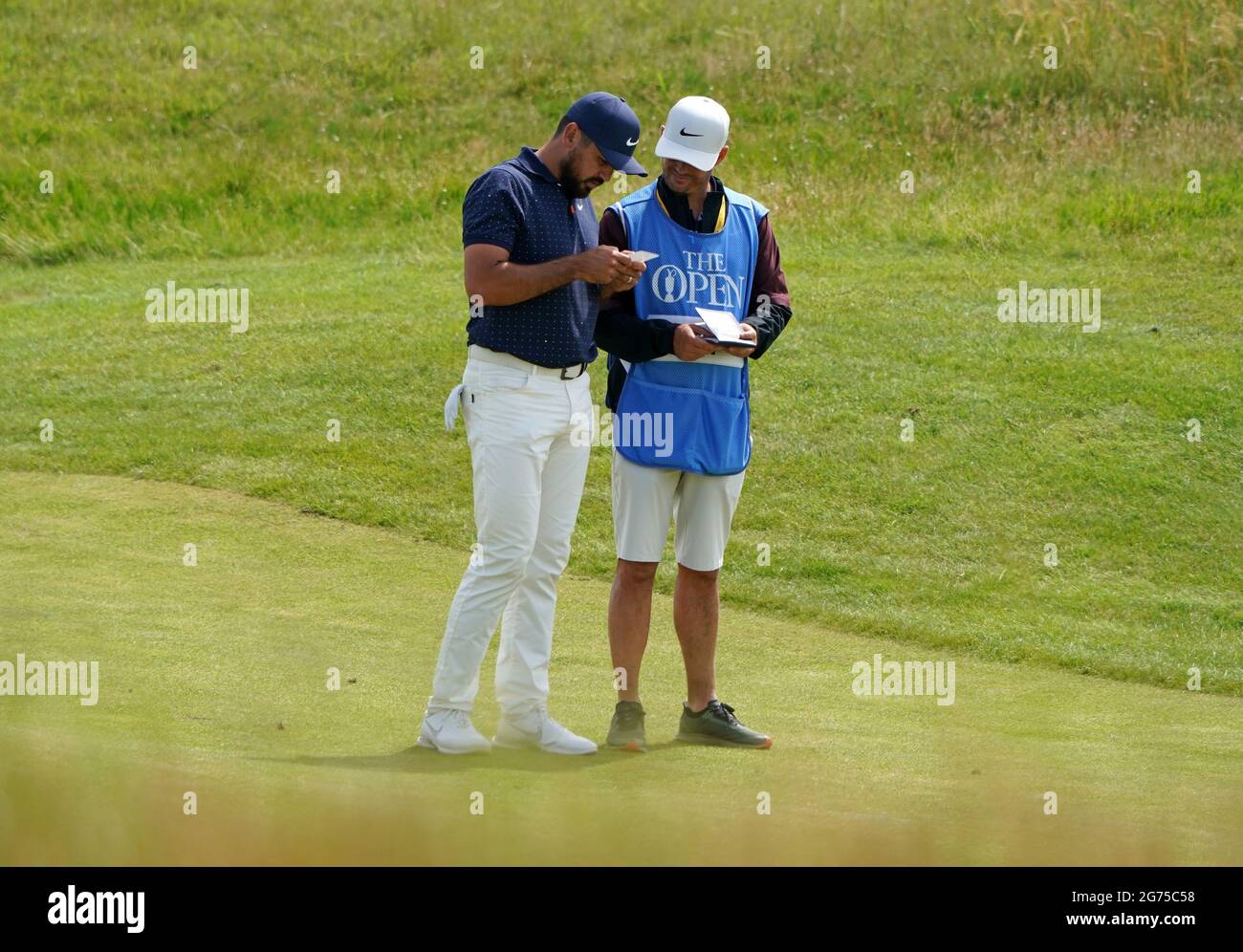 Jason Day with his caddie during the preview day at The Royal St George ...