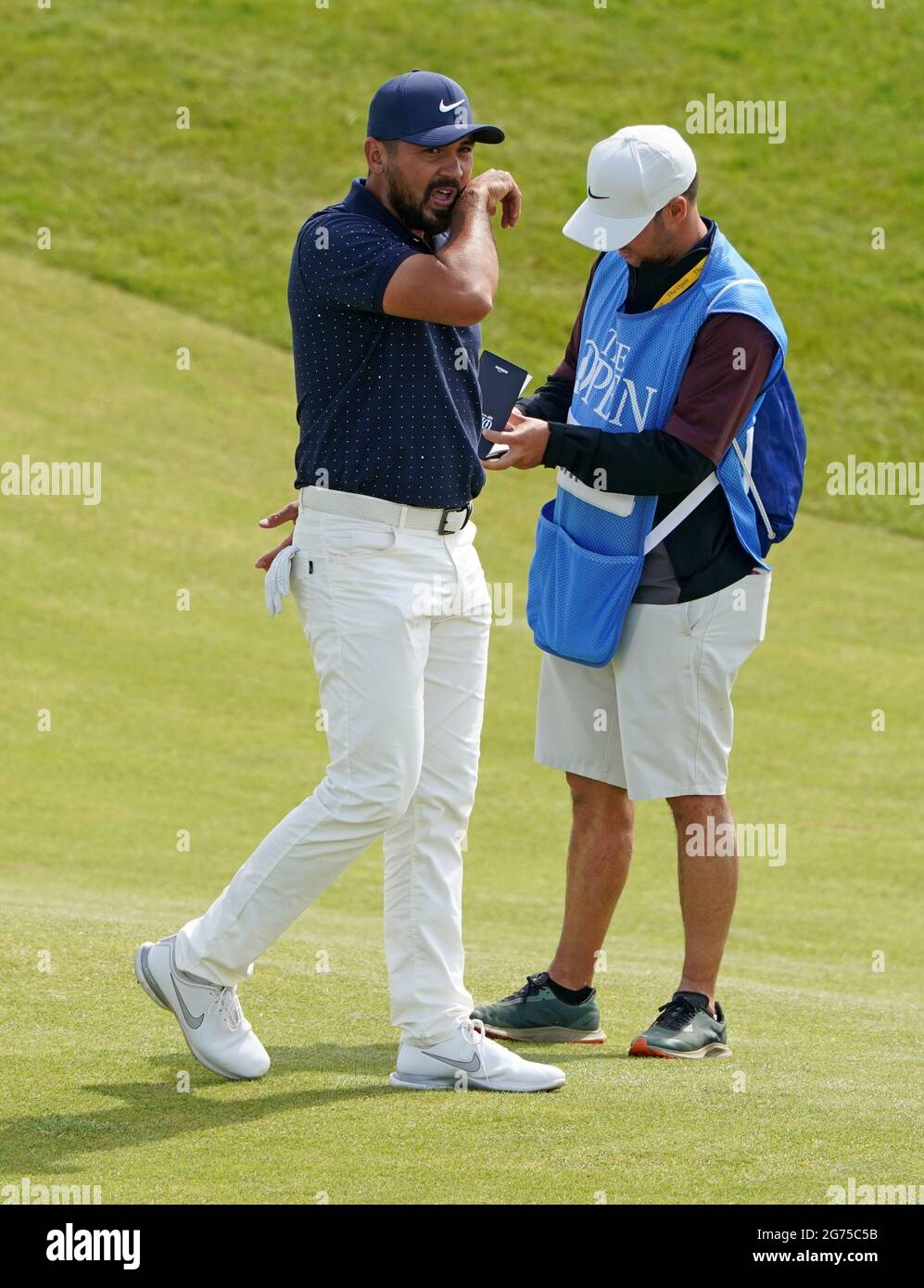 Jason Day with his caddie during the preview day at The Royal St George ...
