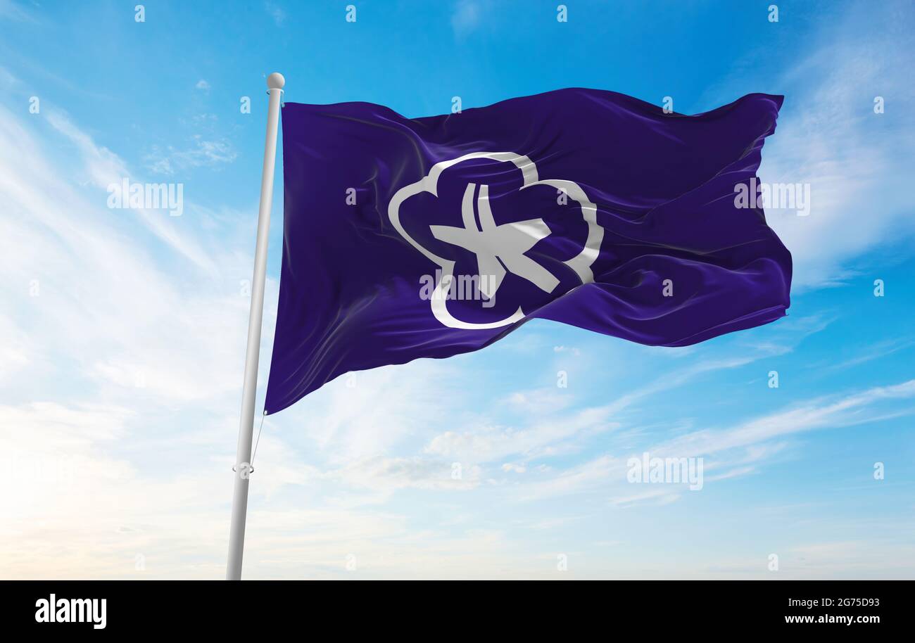 official city flag of Kitakyushu, Fukuoka waving in the wind on ...