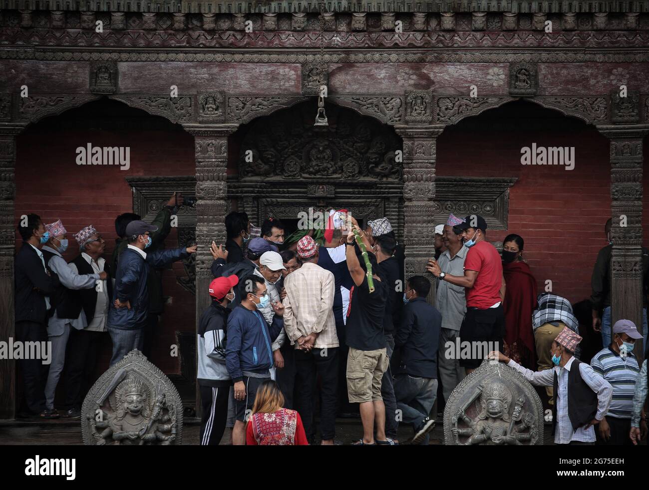 Bhaktapur, Bagmati, Nepal. 11th July, 2021. Nepali people attend a ...